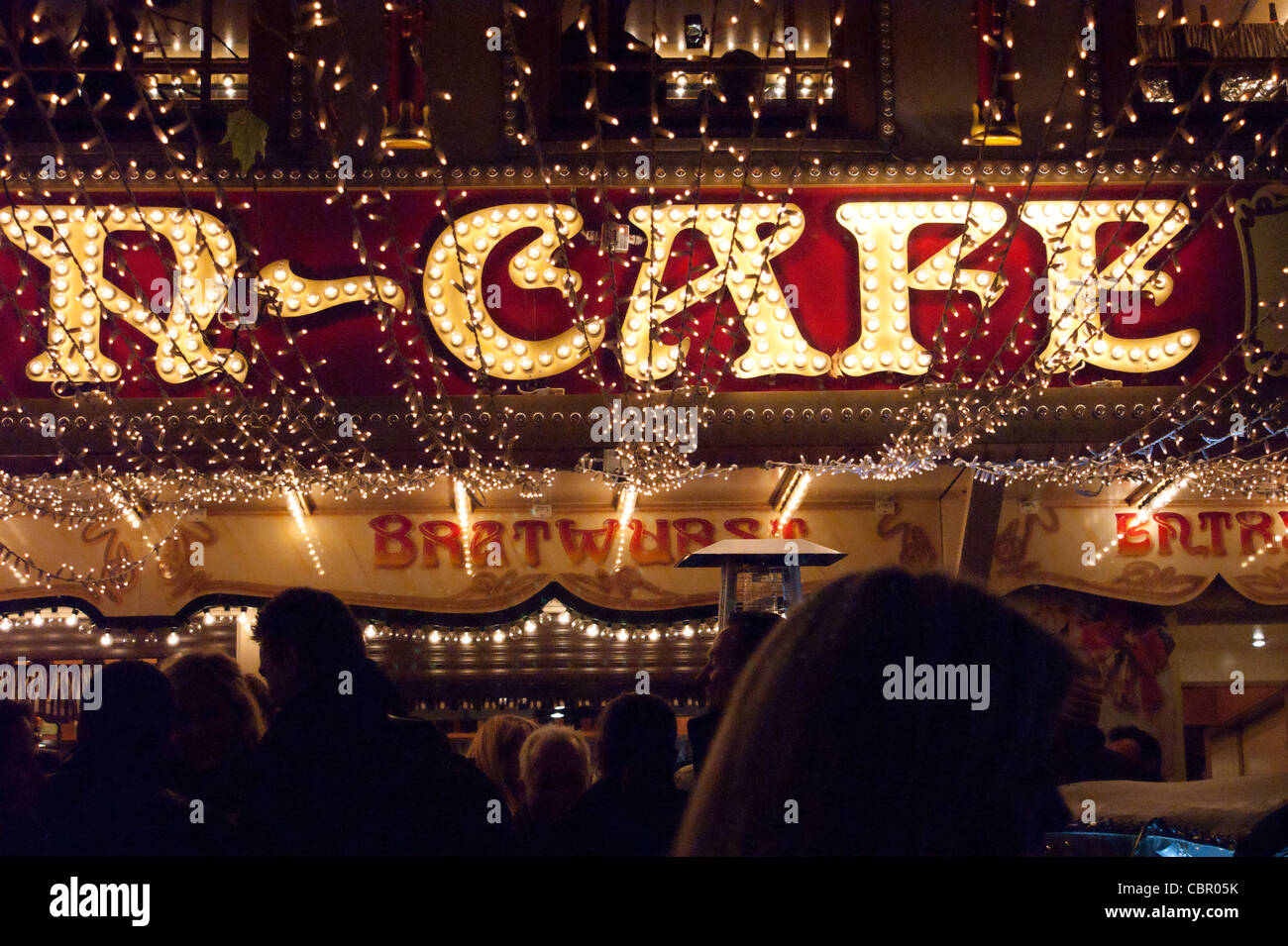 Night time fairground cafe and market Stock Photo - Alamy