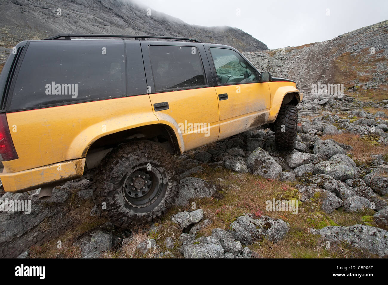 closeup of big four-wheel jeep climbing a mountain Stock Photo - Alamy