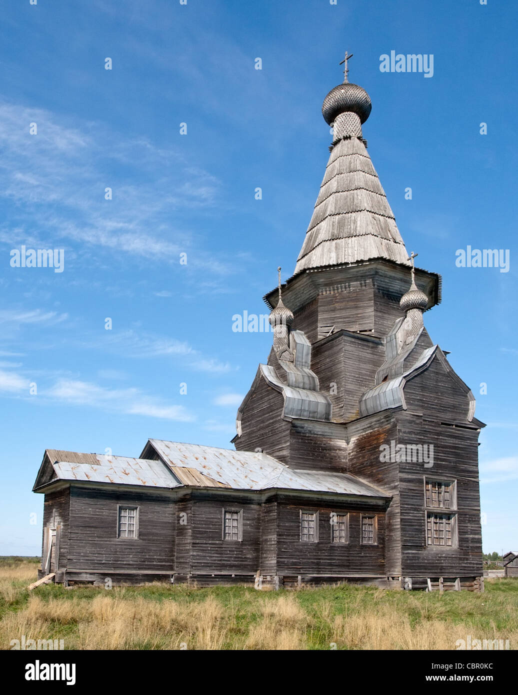 old wooden Russian Orthodox church closeup on blue sky background Stock ...