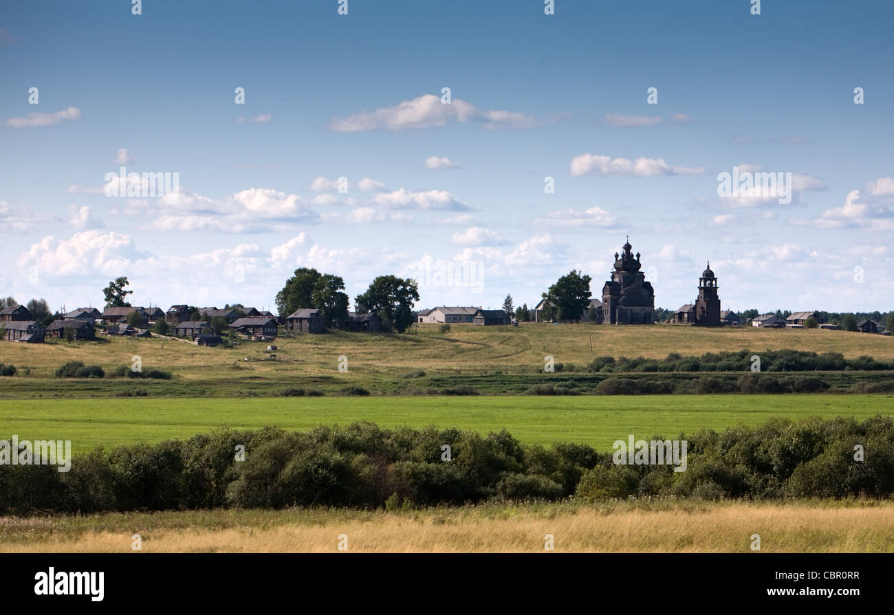 summer landscape with old beautiful Russian village with wooden church ...