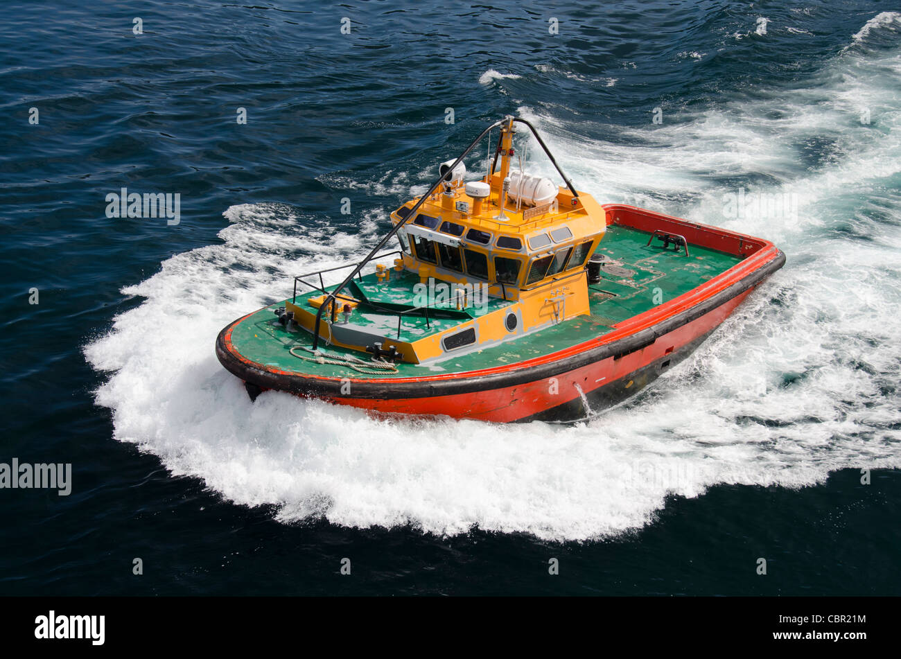 Kingdom of Denmark, Faroe Islands (aka Foroyar). Colorful tug boat in ...