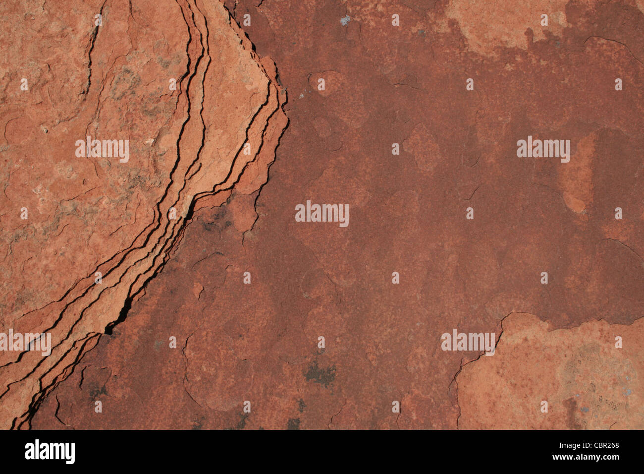 light and dark red flaking sandstone background surface with ...