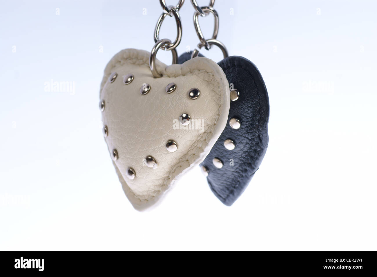 Two hearts fixed by chain, black and white Stock Photo - Alamy