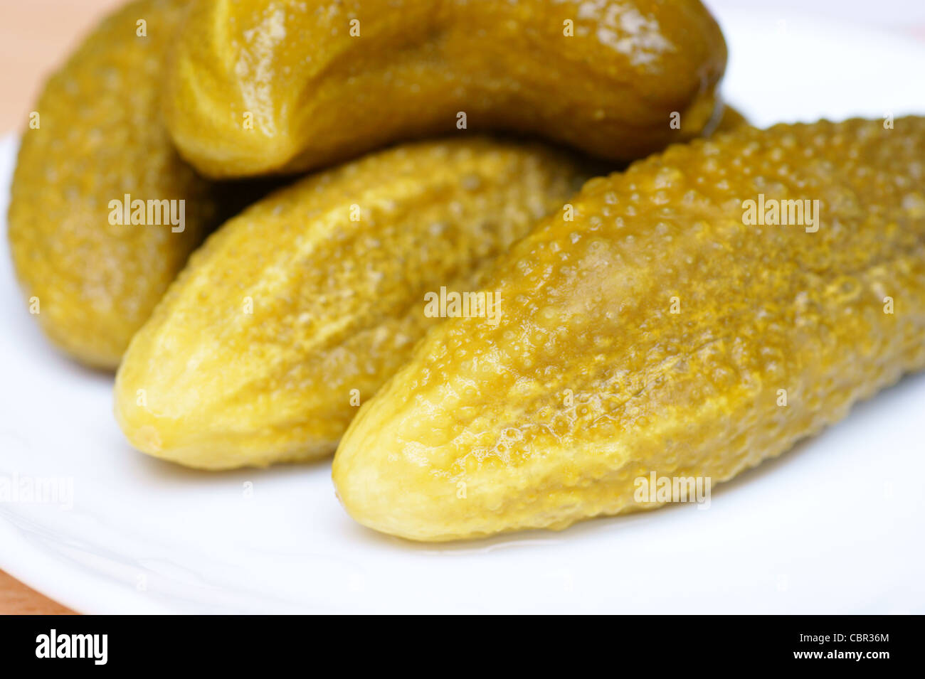 dill pickle on plate, pickles Stock Photo - Alamy