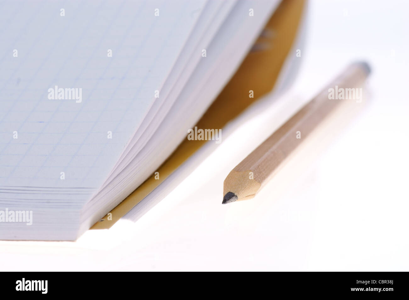 empty notebook and pencil isolated on white background Stock Photo - Alamy