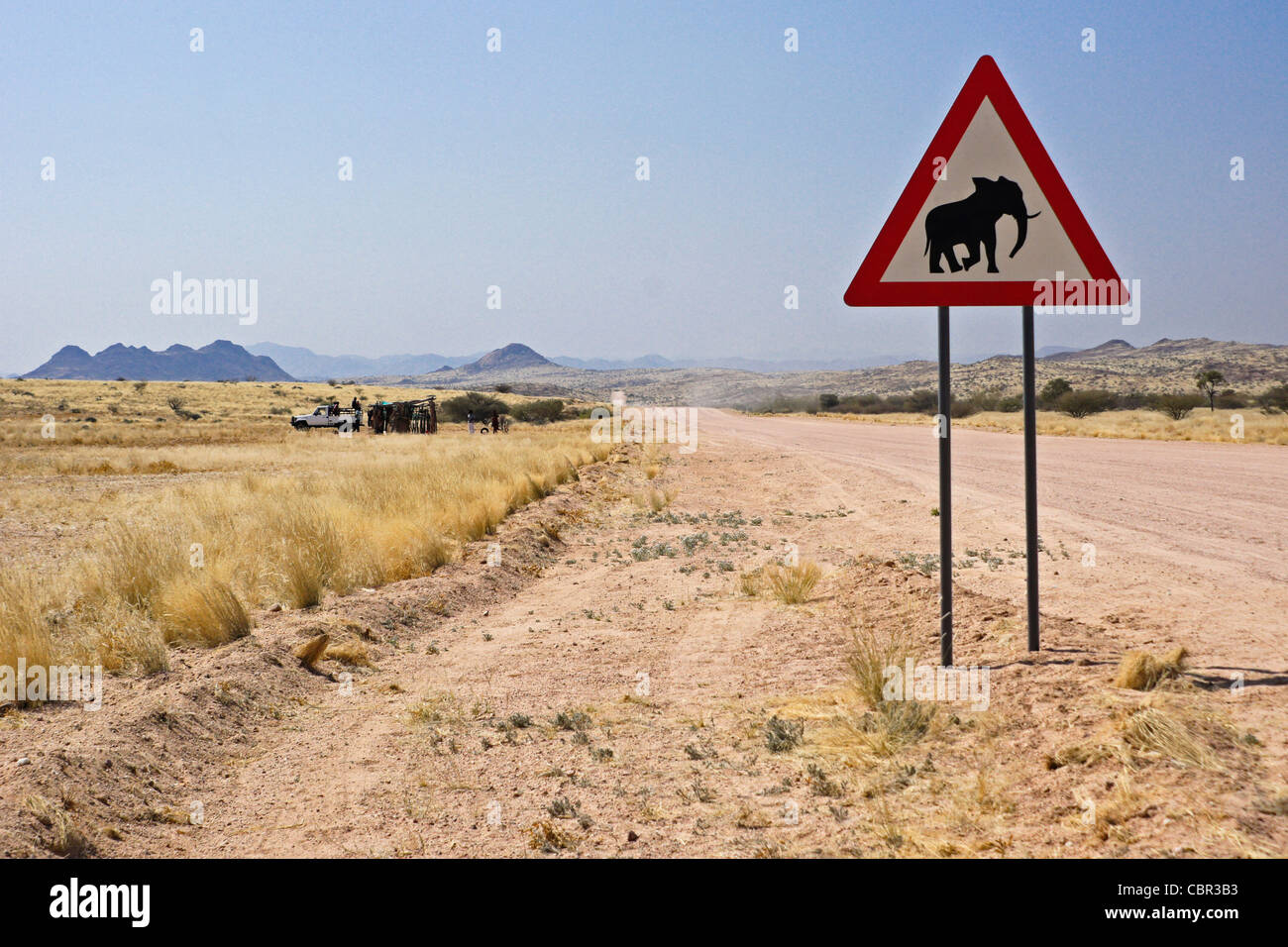 Warning sign for elephants on road, Namibia Stock Photo - Alamy