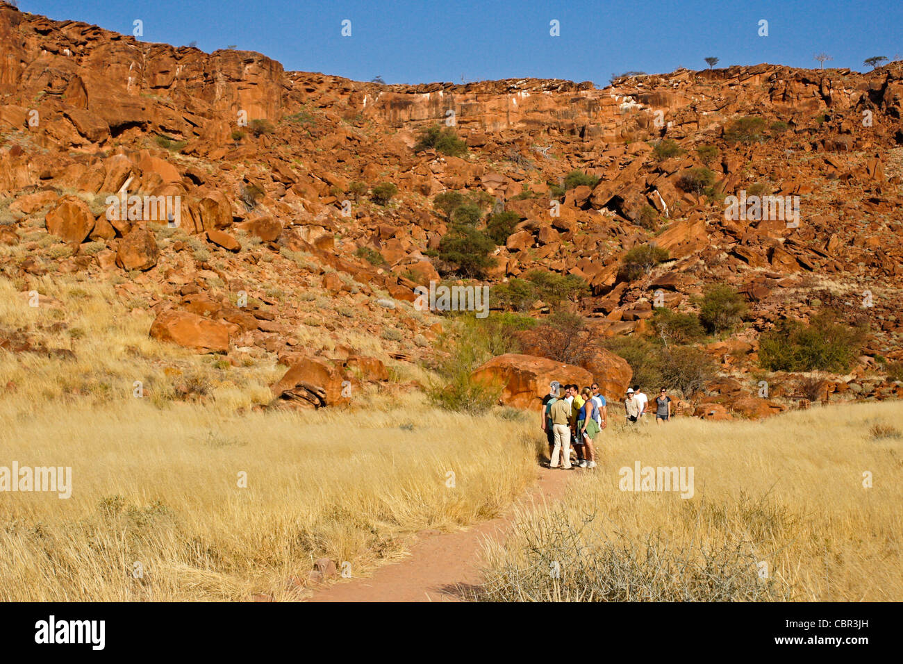 Tourists visiting San rock art site, Twyfelfontein, Namibia Stock Photo ...