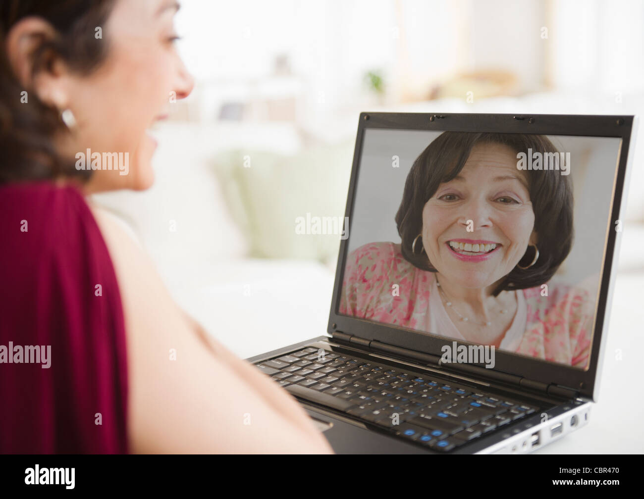 Mother and daughter talking over video chat Stock Photo - Alamy