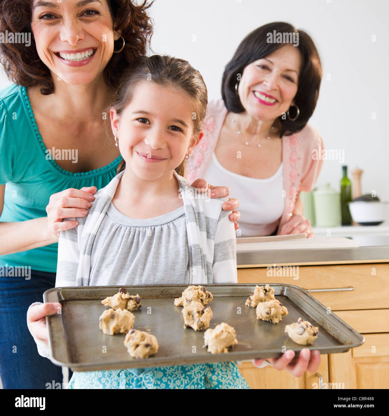 Family baking cookies together Stock Photo - Alamy