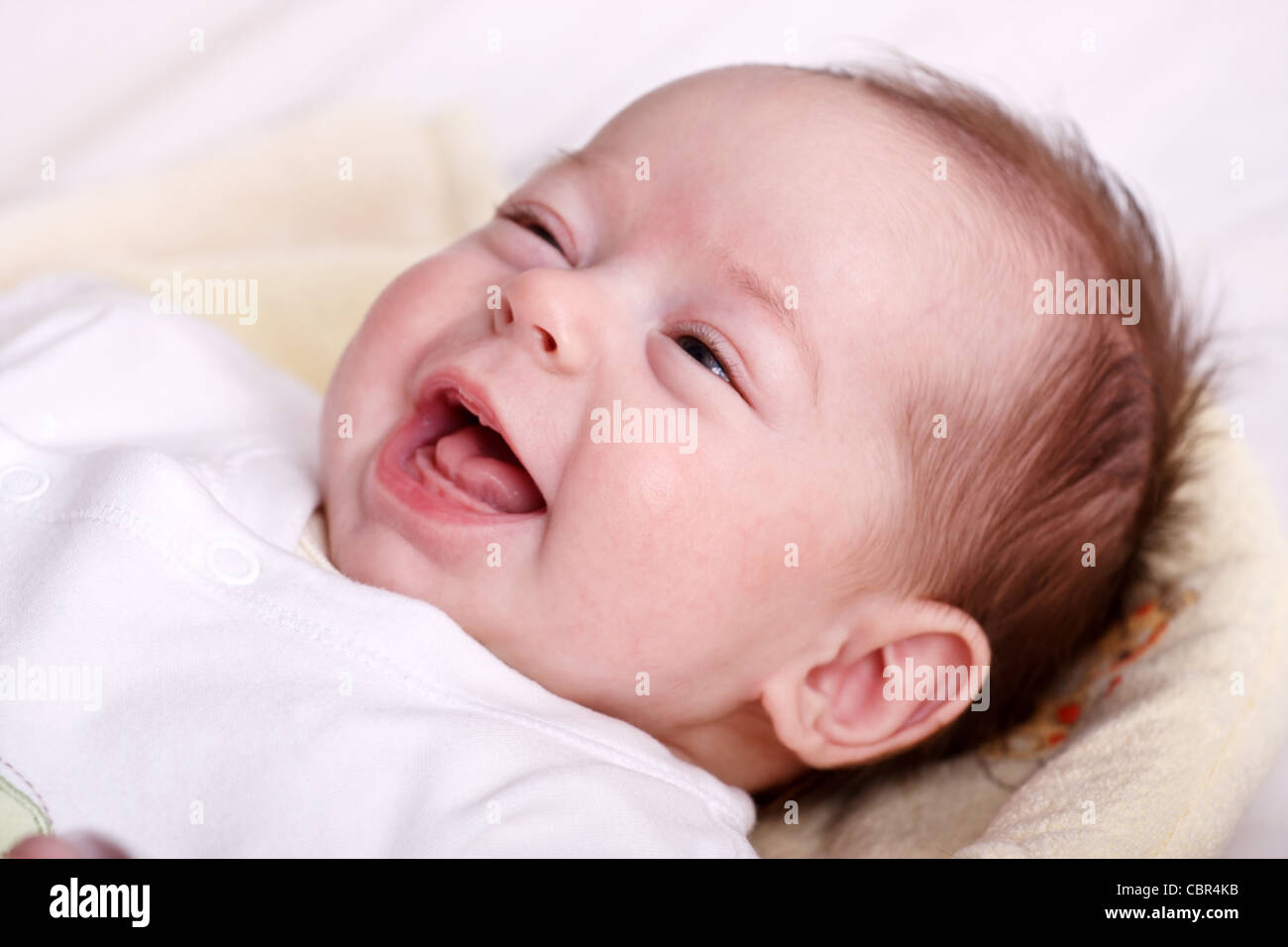 Cute baby girl laughing with toothless smile Stock Photo - Alamy