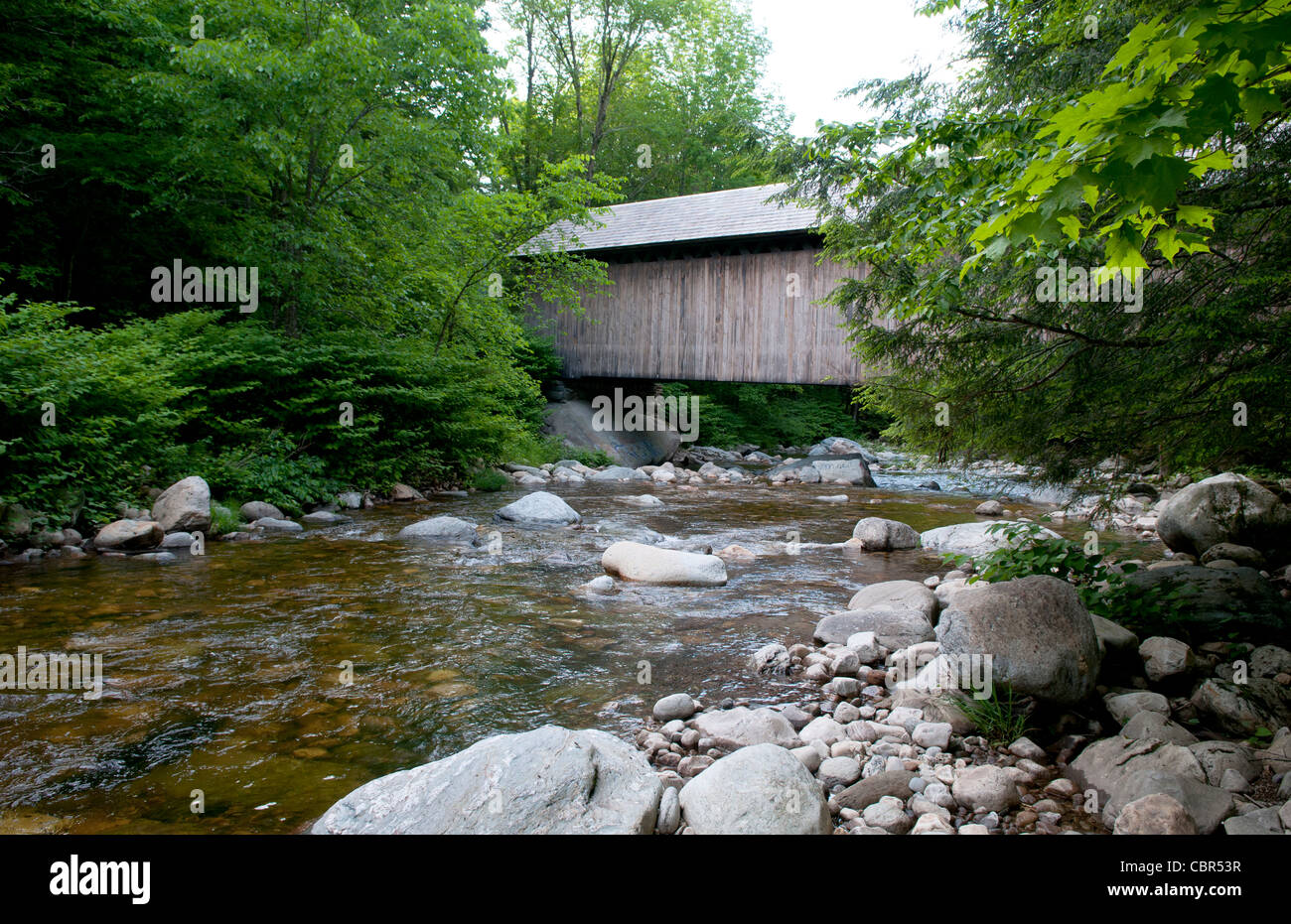 Covered Bridges of Vermont by river with rocks Brown Bridge in ...