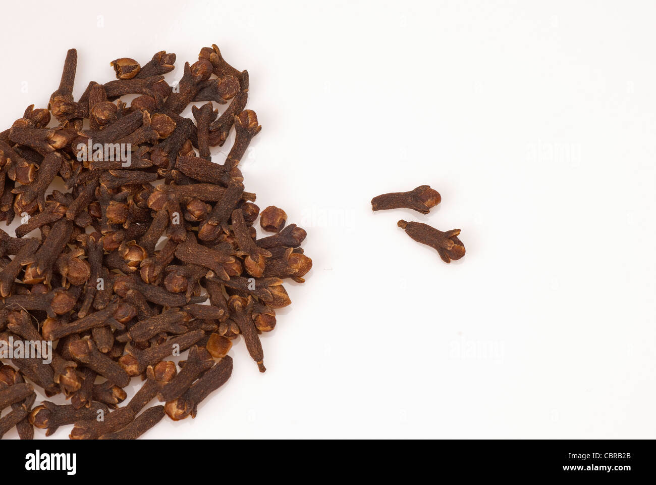 Stack of whole clove buds isolated with copy space Stock Photo - Alamy