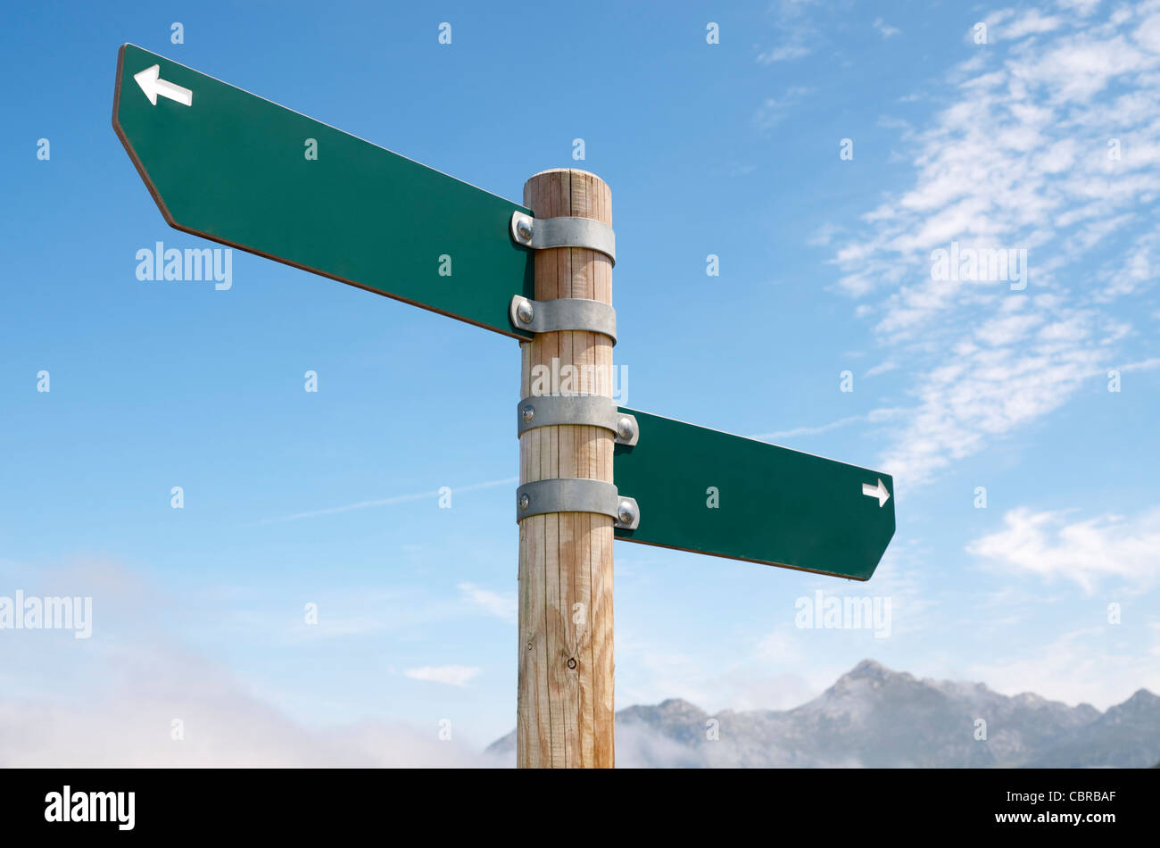 view of two wooden directional signs on a pole Stock Photo - Alamy