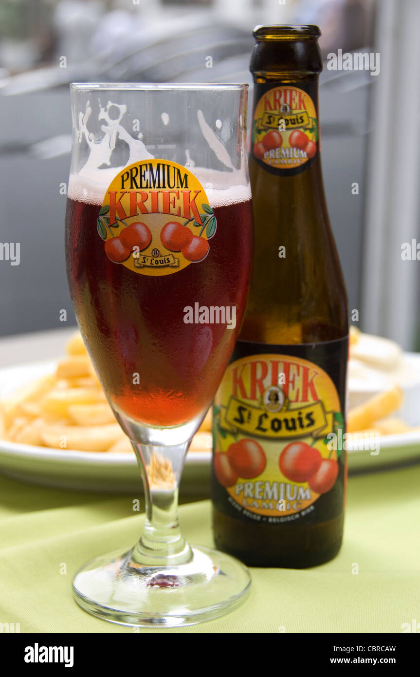 Vertical close up of a traditional Fruit Lambic Belgian beer bottle and ...