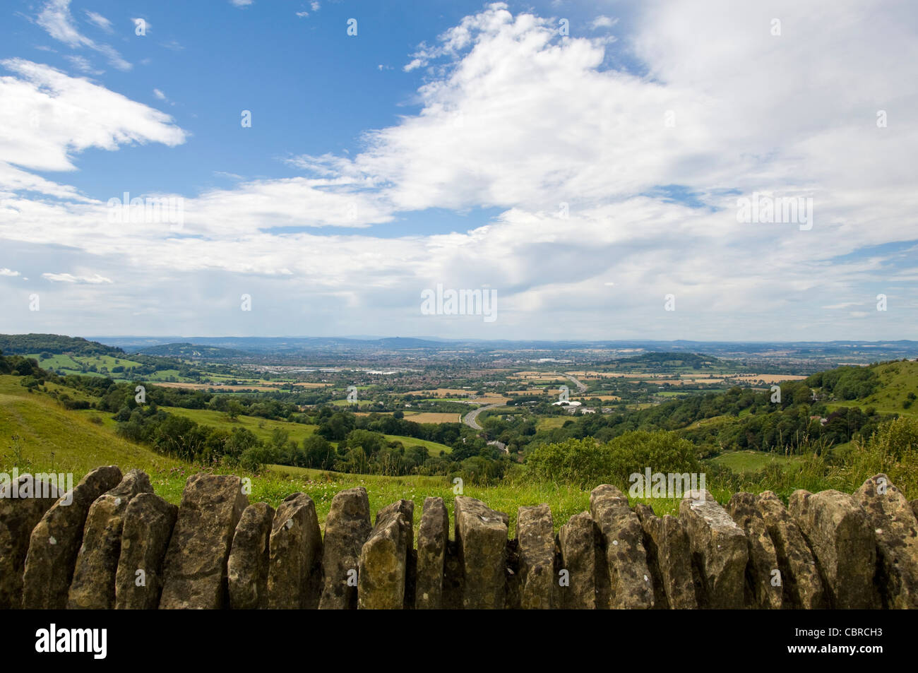 Horizontal wide angle from Barrow Wake viewpoint near Birdlip, across ...