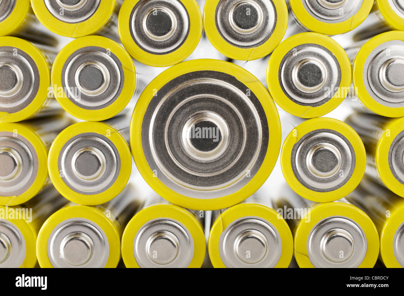 forefront of a group of yellow batteries Stock Photo - Alamy