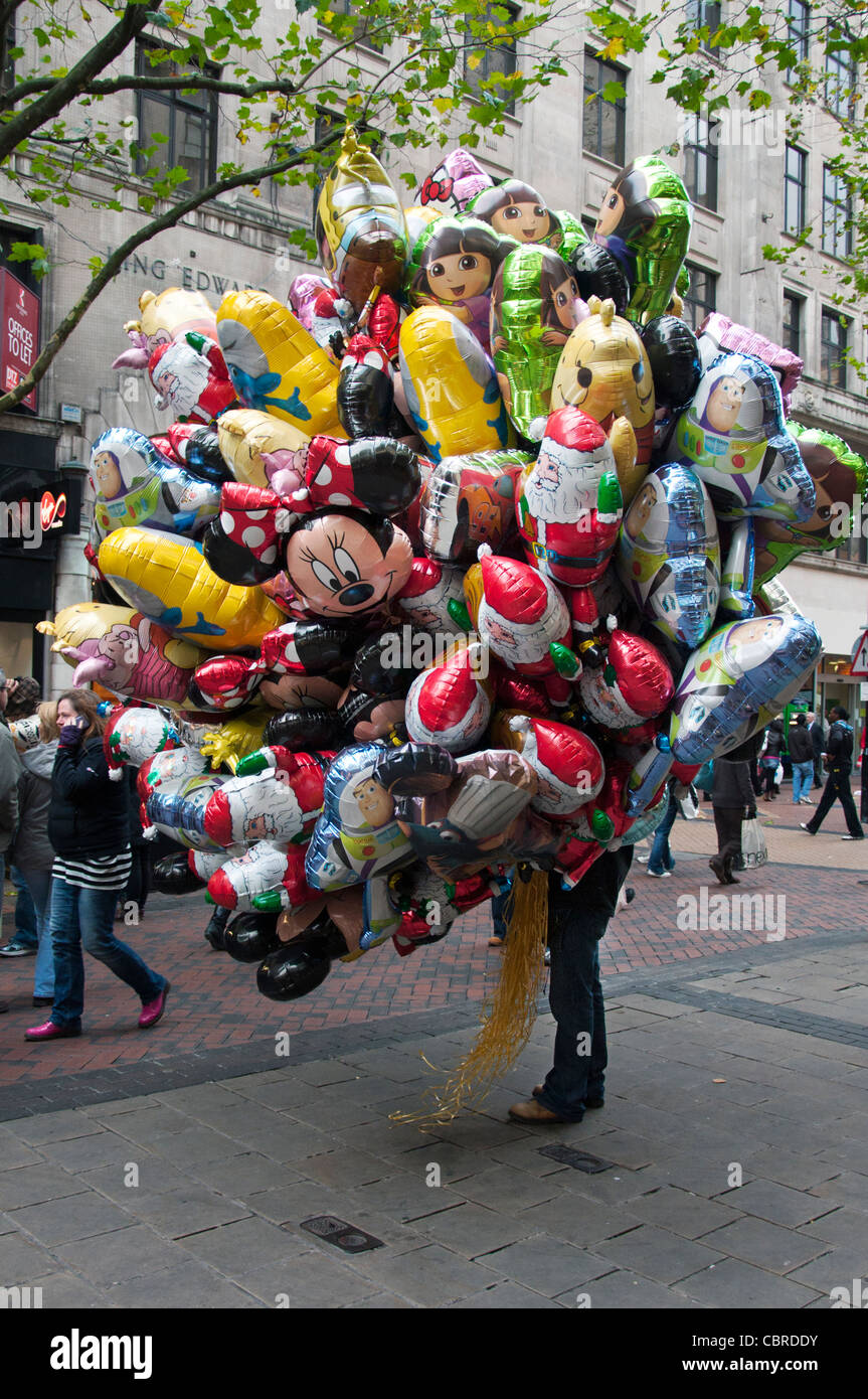Girl selling balloons hi-res stock photography and images - Alamy