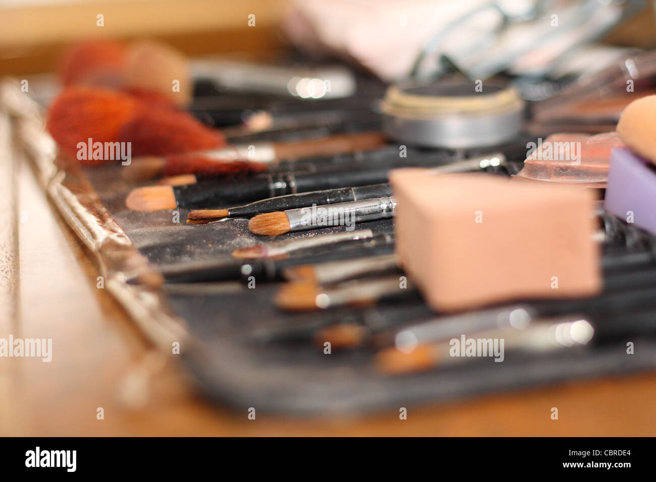 A tray of make-up brushes and equipment at a table Stock Photo - Alamy