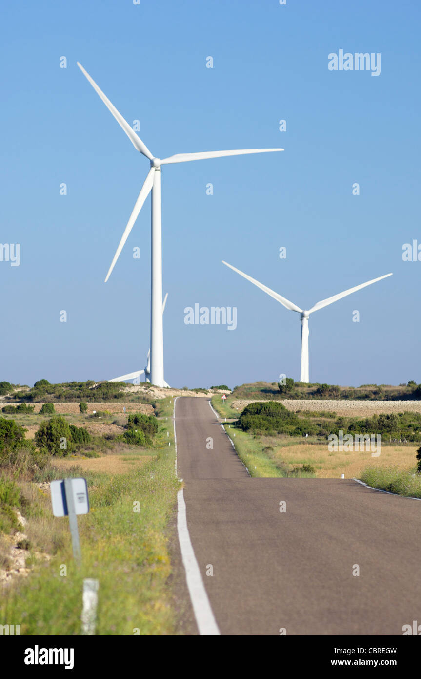 windmills for electric power production and road Stock Photo - Alamy