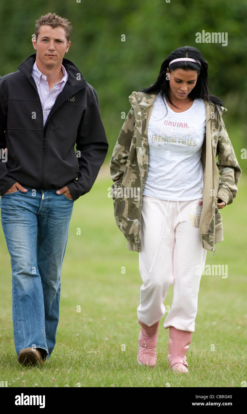 Katie Price with trainer Andrew Gould at Hickstead Show Ground. Picture by James Boardman Stock ...
