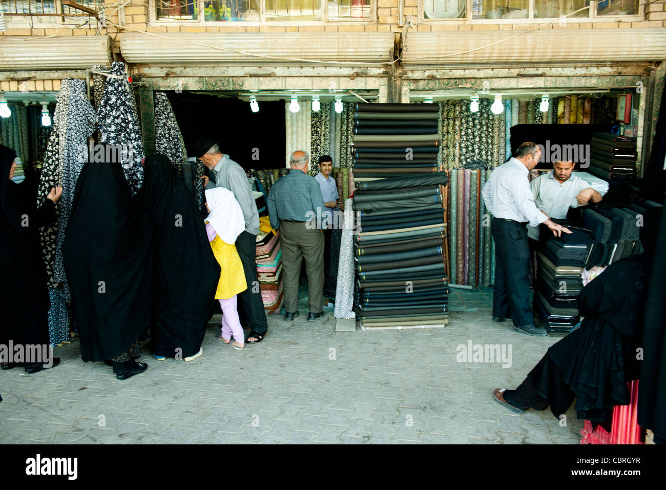 Cloth shop in the souk by the Imam Husein (Husayn) and Abbas shrines in ...