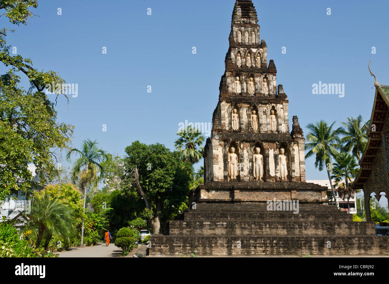 A 900 year old chedi (stupa) with standing Buddhas at Wat Chama Thewi ...