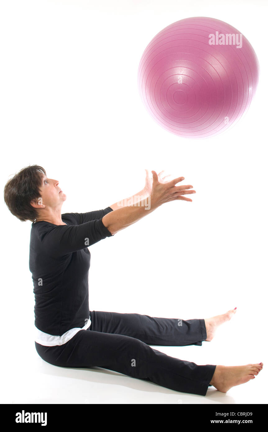 middle age senior woman fitness exercise with core training ball Stock ...