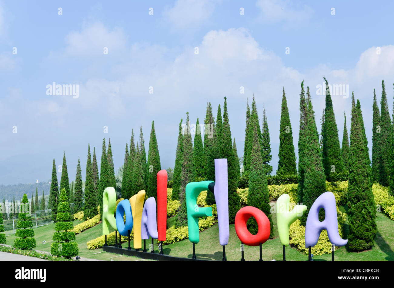 Colorful Royal Flora sign with pointed trees on hill at Royal Flora ...