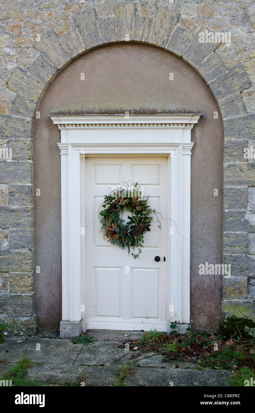 Christmas wreath on door West Lodge Parham estate winter West Sussex ...