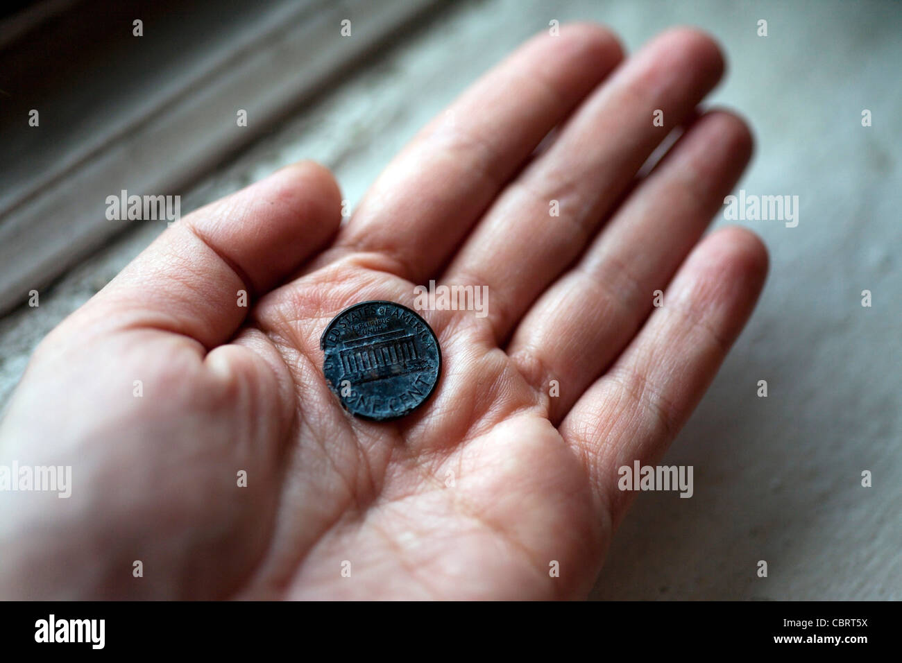 A penny in the hand Stock Photo - Alamy