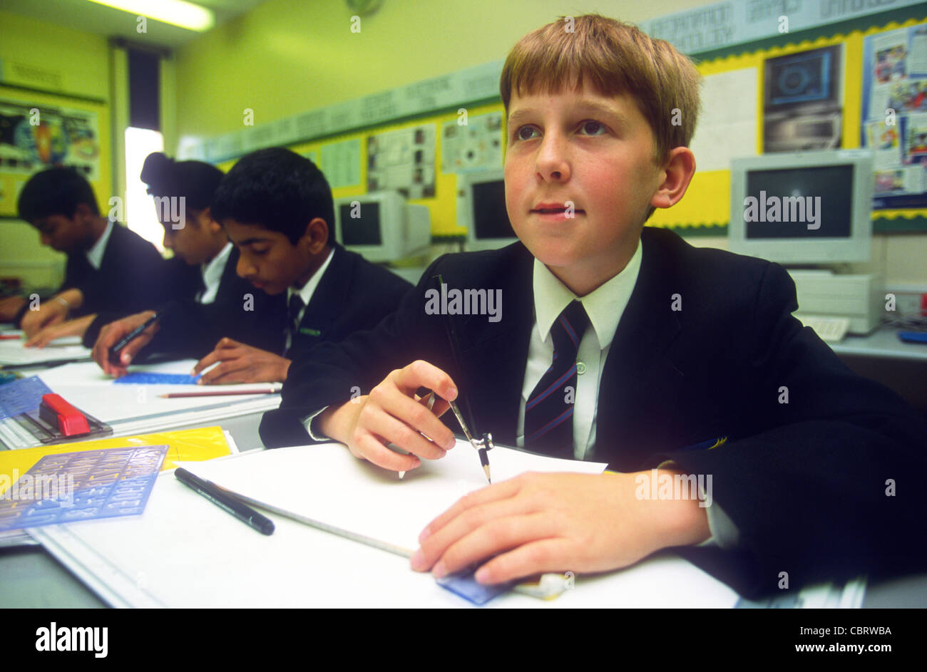 Pupil using compass in class, Heathland School, Hounslow, Middlesex, UK ...