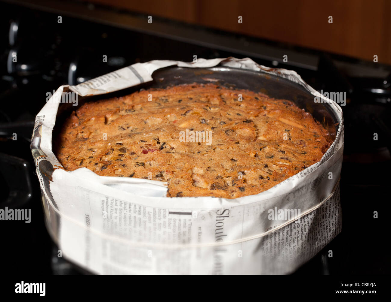 Traditional xmas cake straight from the oven and still wrapped in ...