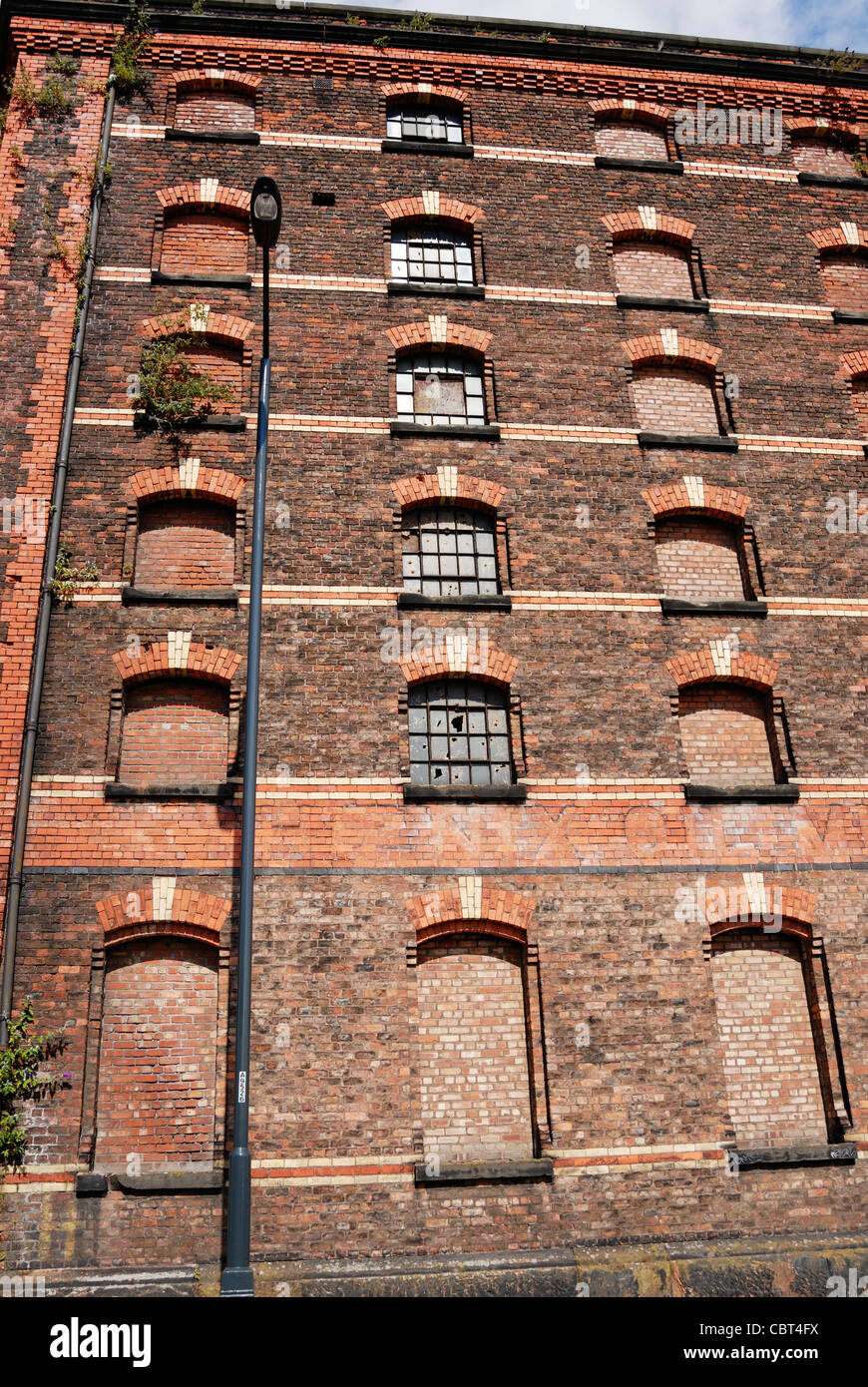 Bricked up windows in old warehouses in Liverpool dock area Stock Photo ...