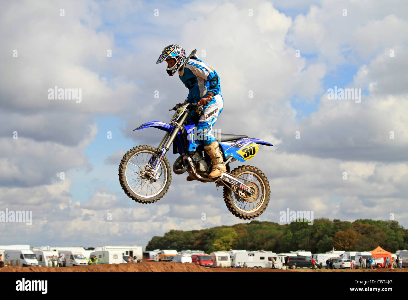 a motocross rider jumps high into the air Stock Photo - Alamy