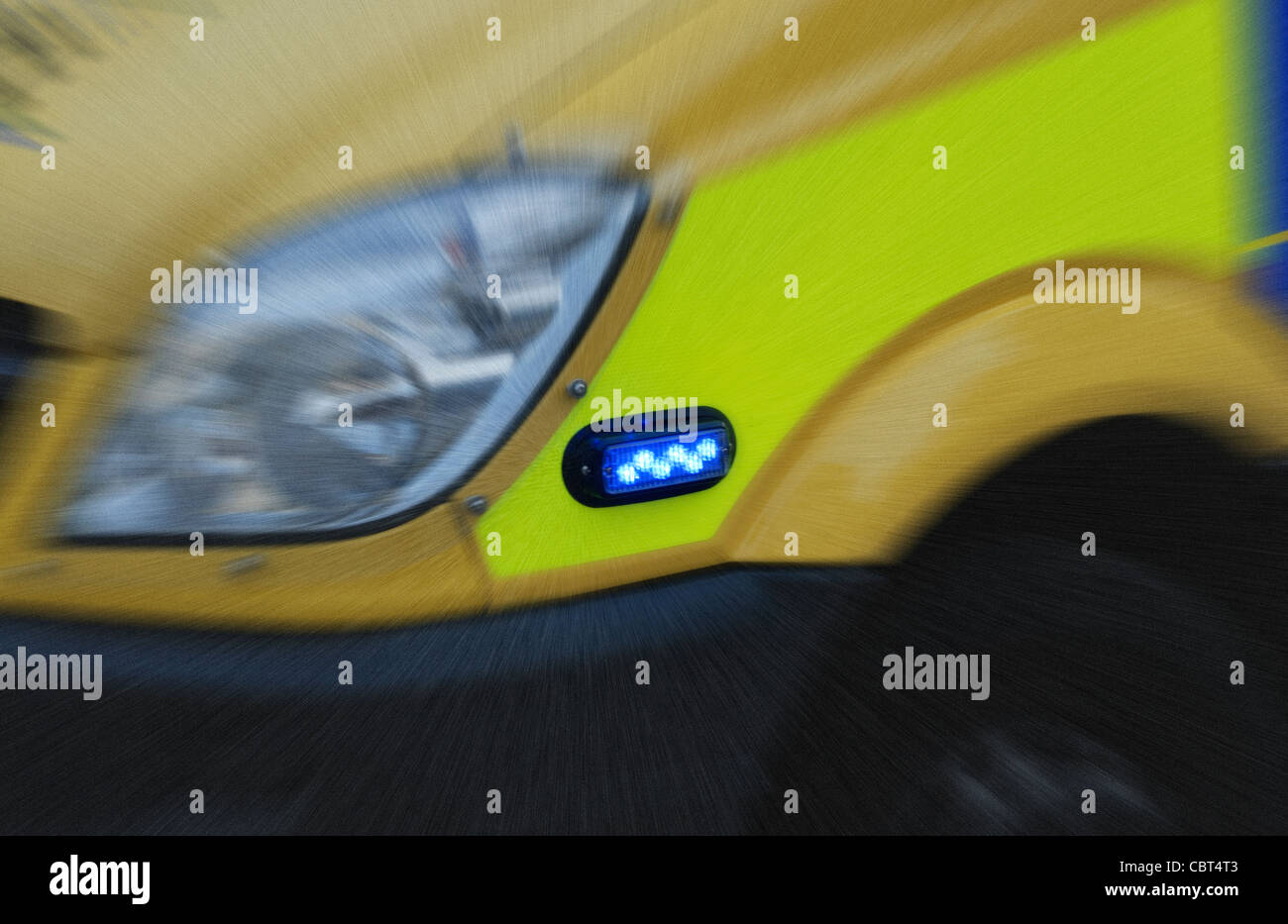 Yellow police vehicle speeding to an emergency Stock Photo - Alamy