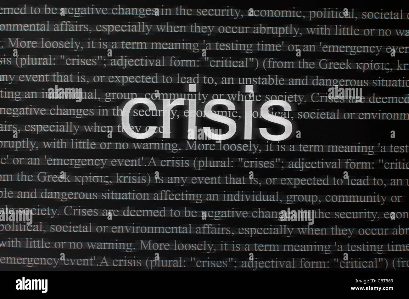 Typed text Crisis on black paper Stock Photo - Alamy