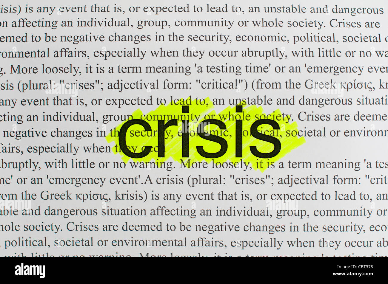 Typed text Crisis on white paper.Yellow marked Stock Photo - Alamy