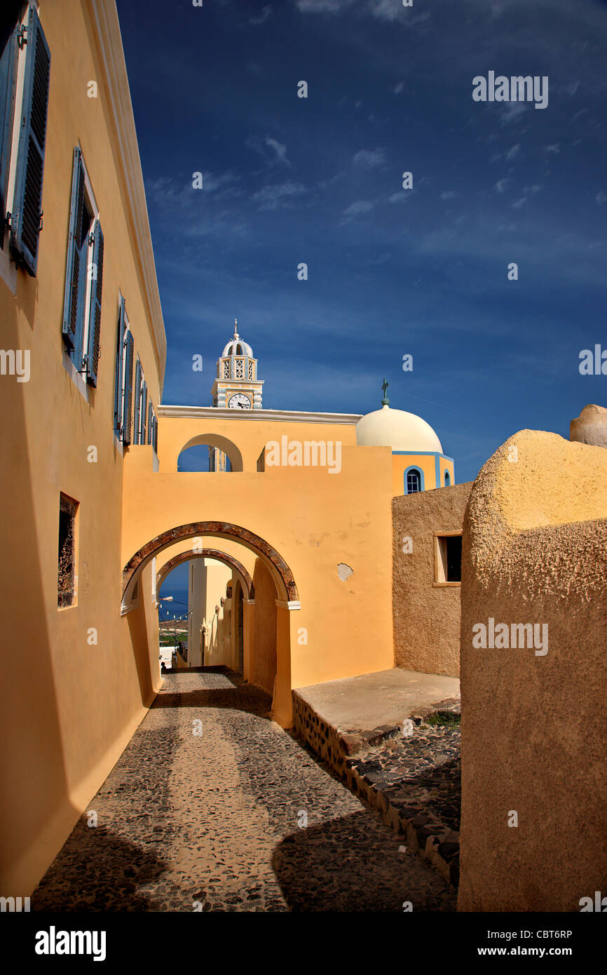 A beautiful alley that leads to the Catholic church in Fira village ...