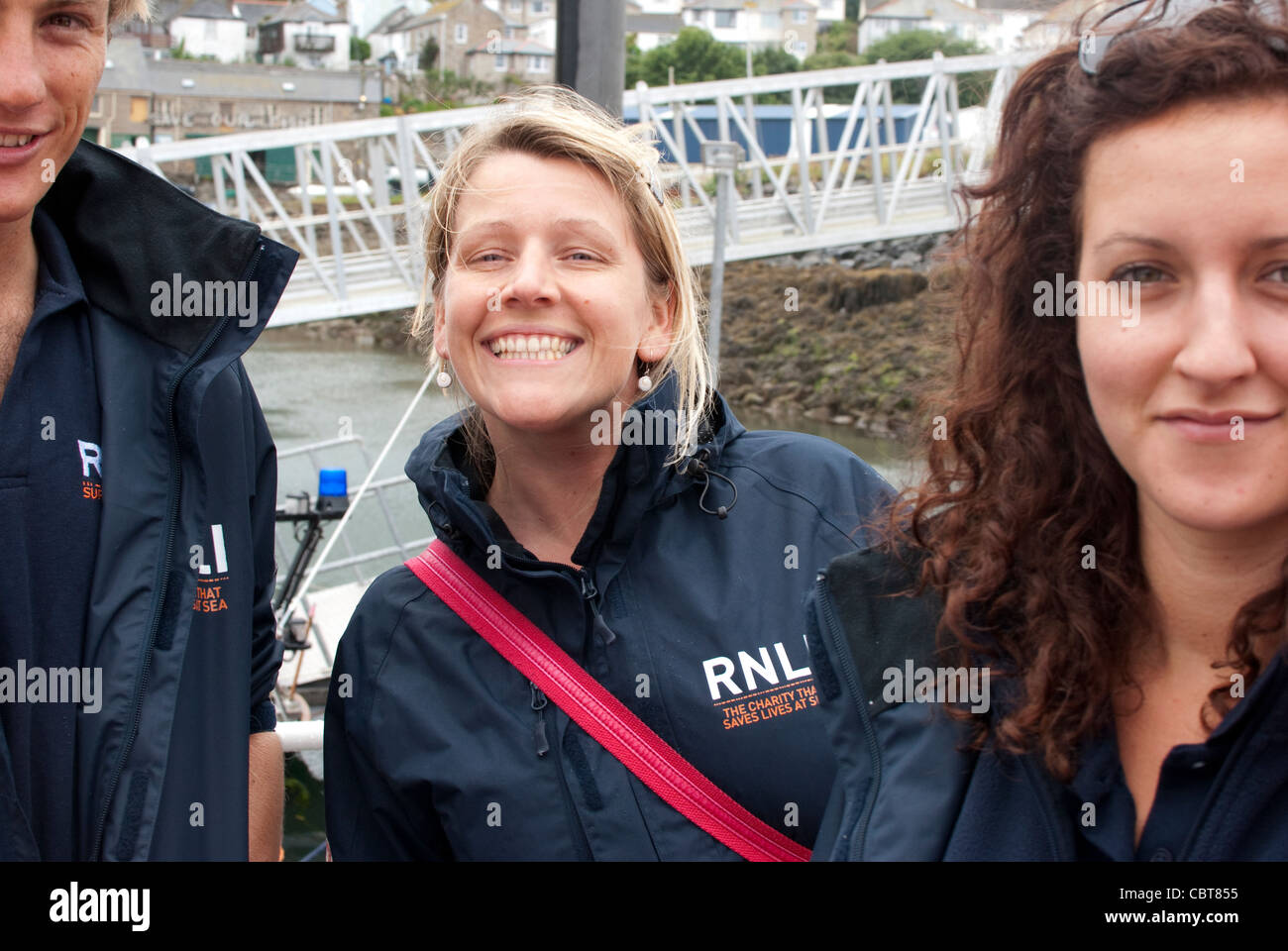 RNLI members stand on a Lifeboat Stock Photo - Alamy