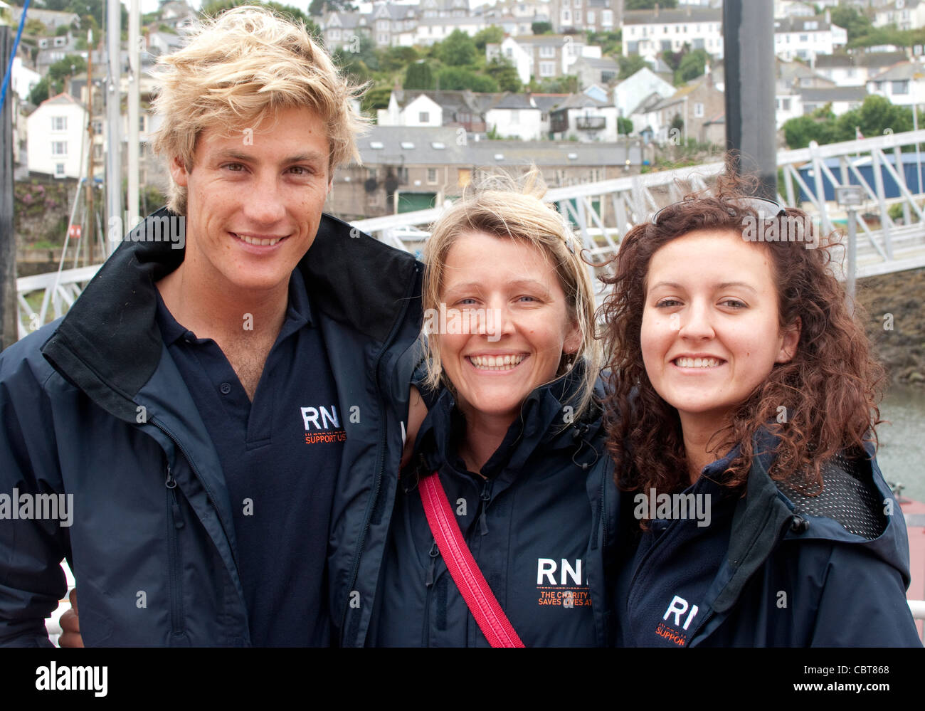 RNLI members stand on a Lifeboat Stock Photo - Alamy