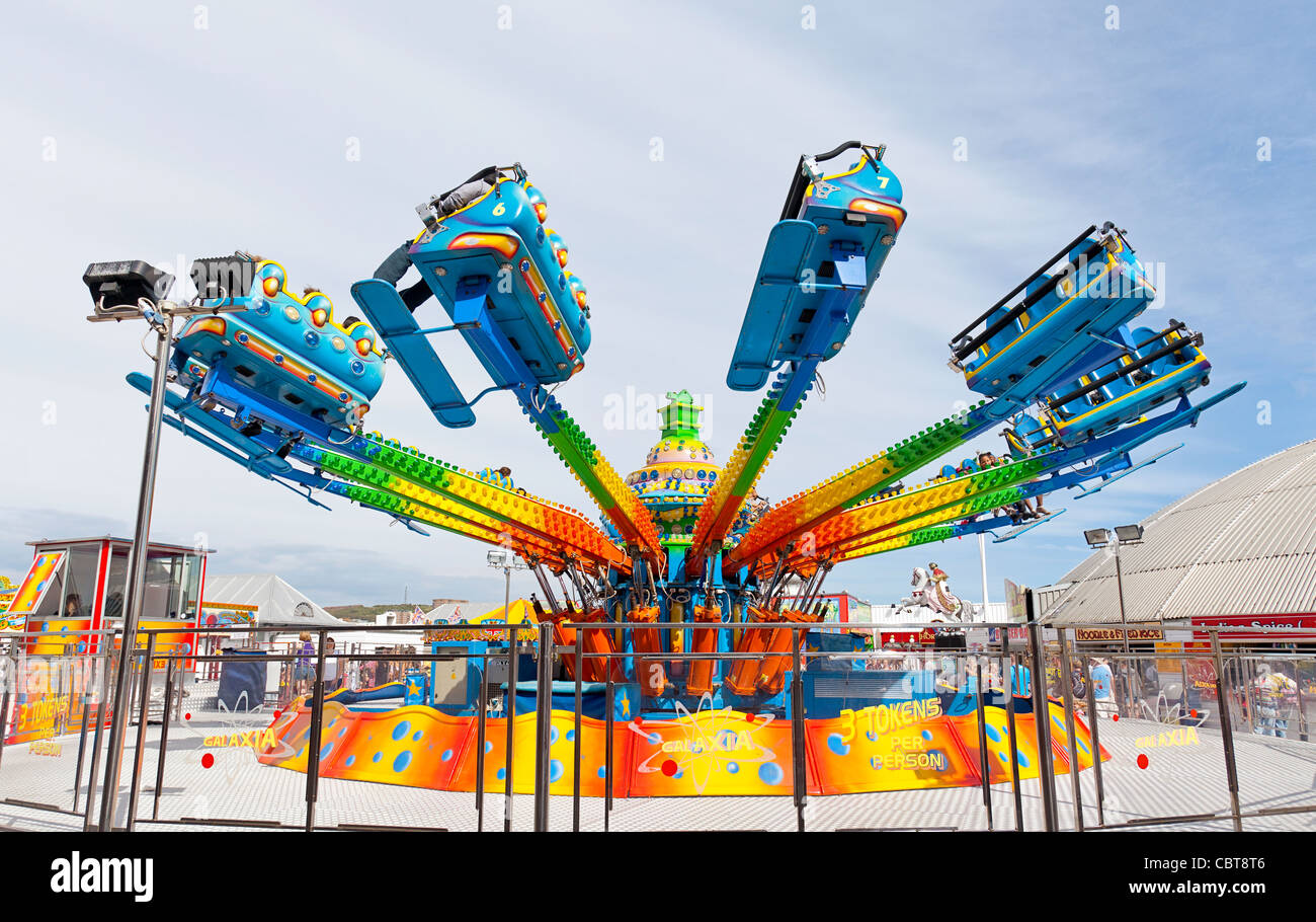 People on holiday and vacation enjoying themselves on amusement park ...
