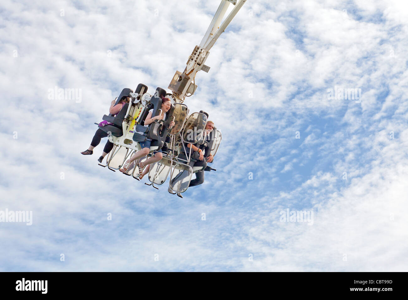 People on holiday and vacation enjoying themselves on an amusement park ...