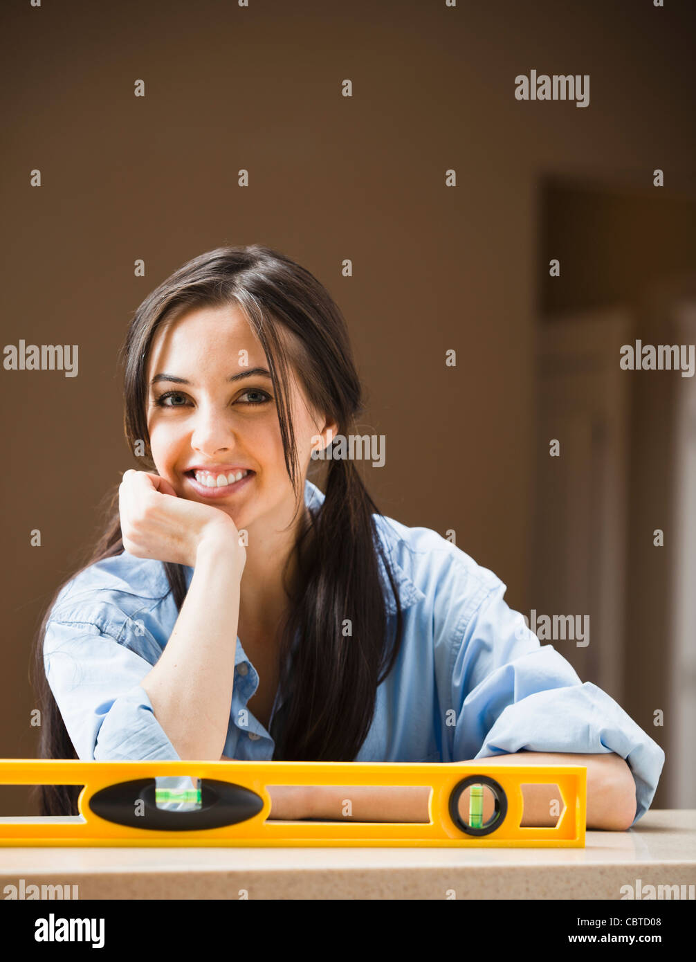 Caucasian woman with level Stock Photo - Alamy