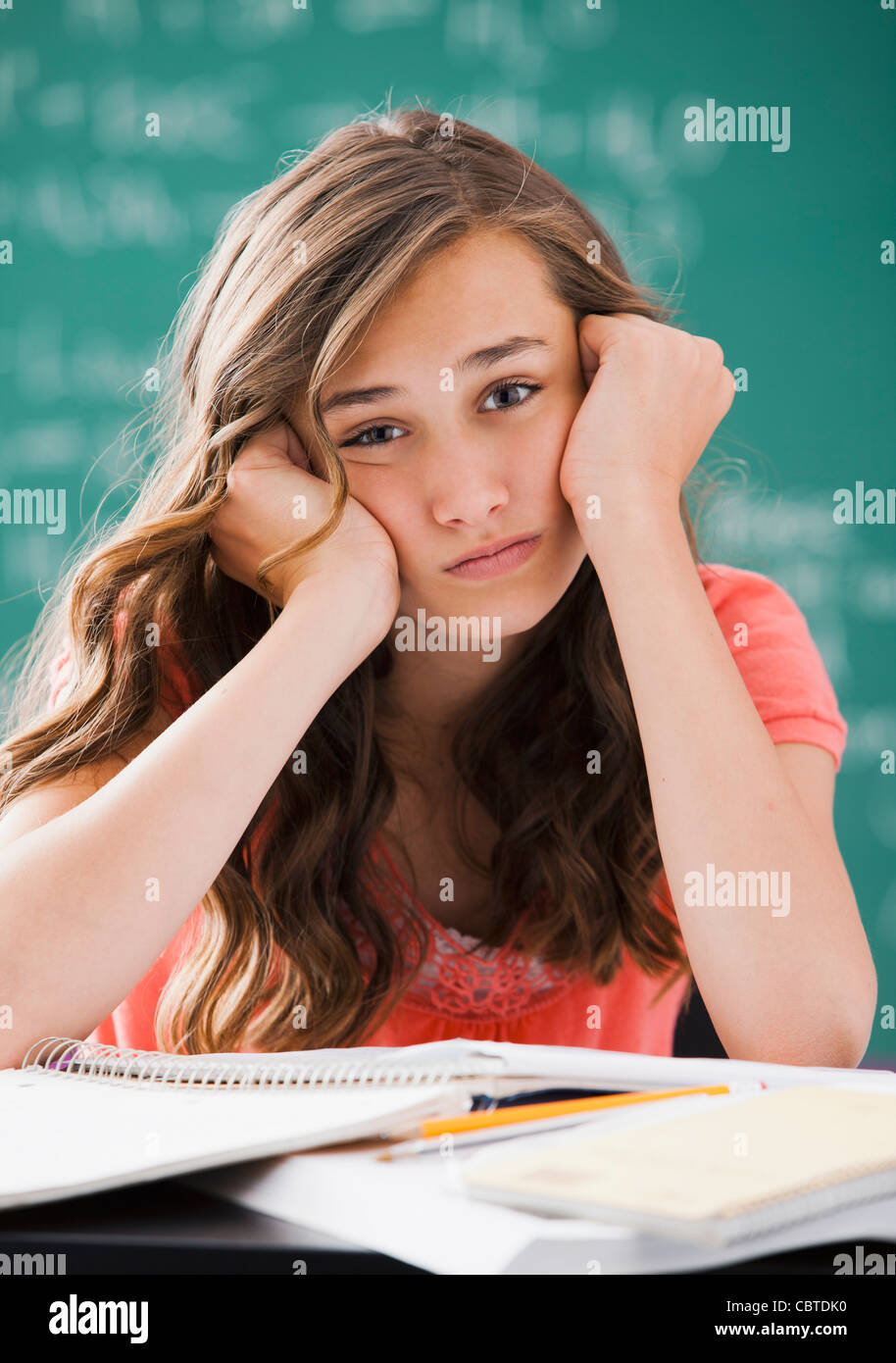Bored Caucasian teenager studying on classroom Stock Photo - Alamy