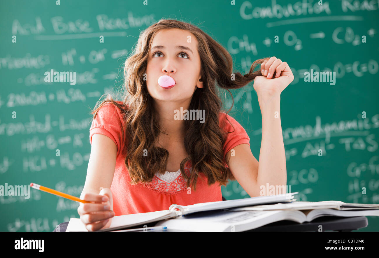Caucasian teenager daydreaming in classroom Stock Photo - Alamy