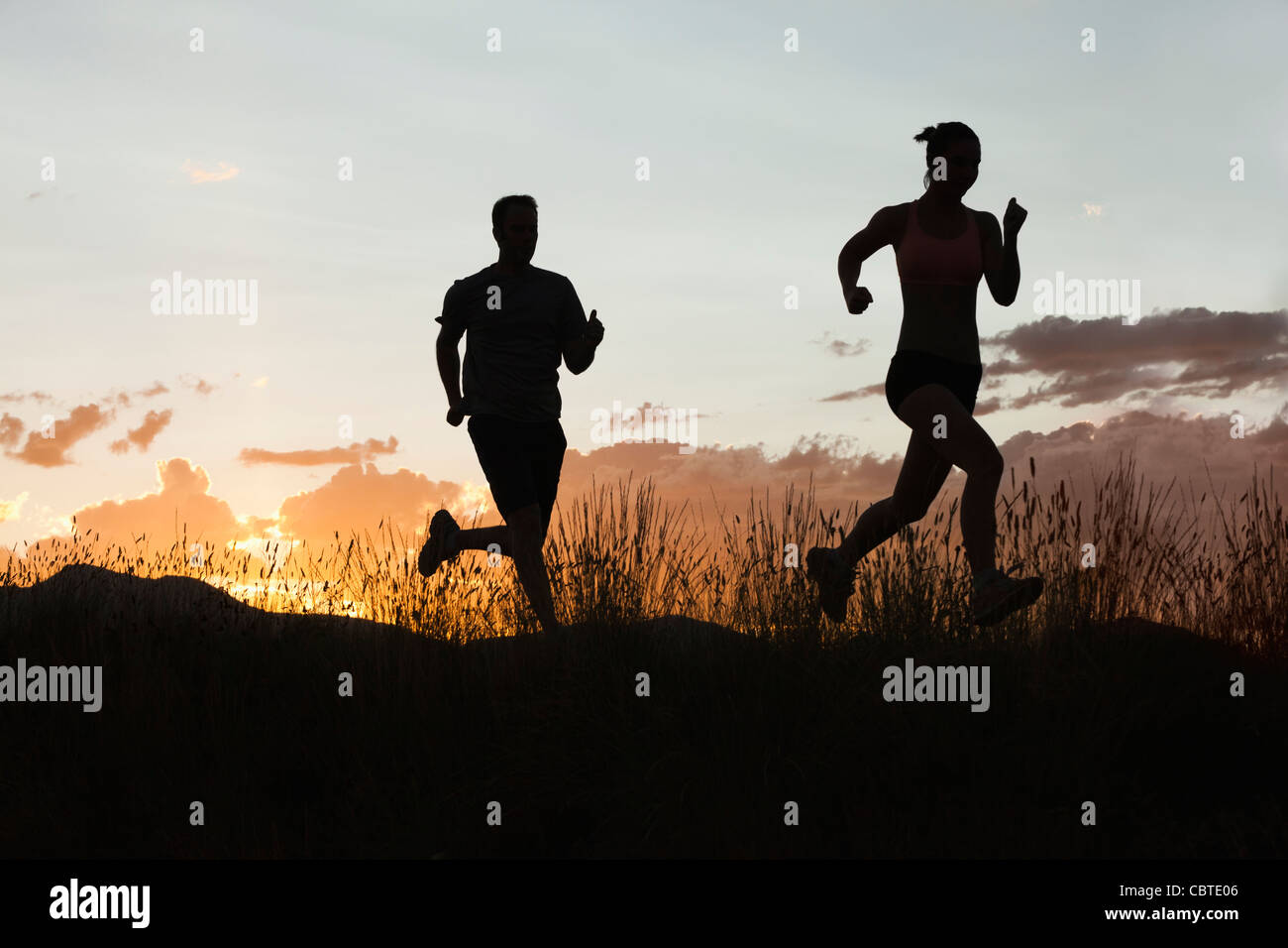 Woman silhouette running away hi-res stock photography and images - Alamy