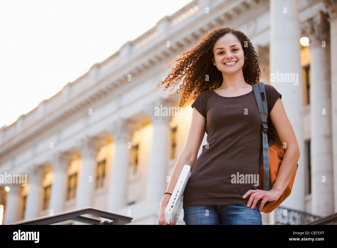Caucasian college student holding laptop outdoors Stock Photo - Alamy