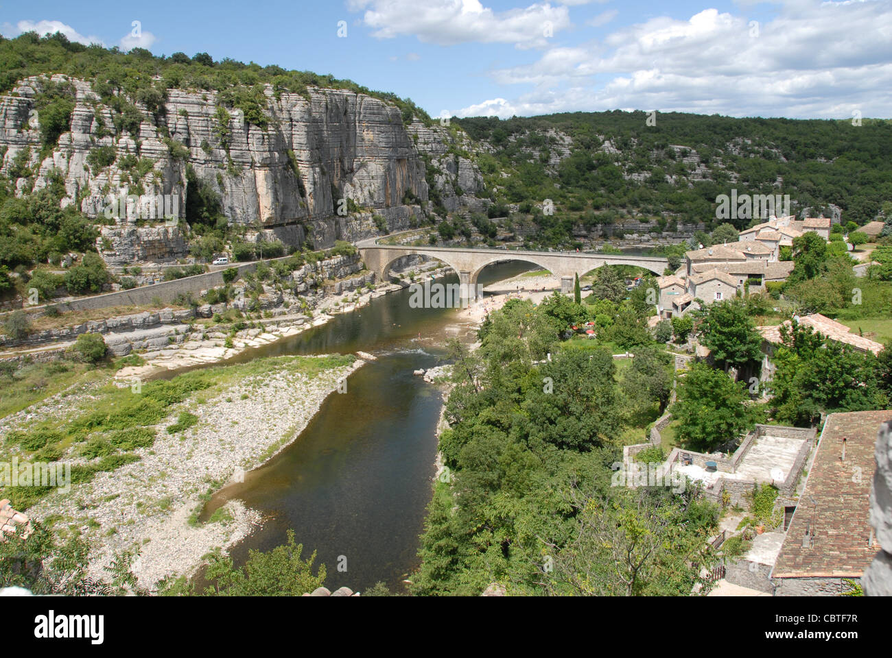 The Ardeche river crossed by a bridge at Balazuc, one of France's most ...