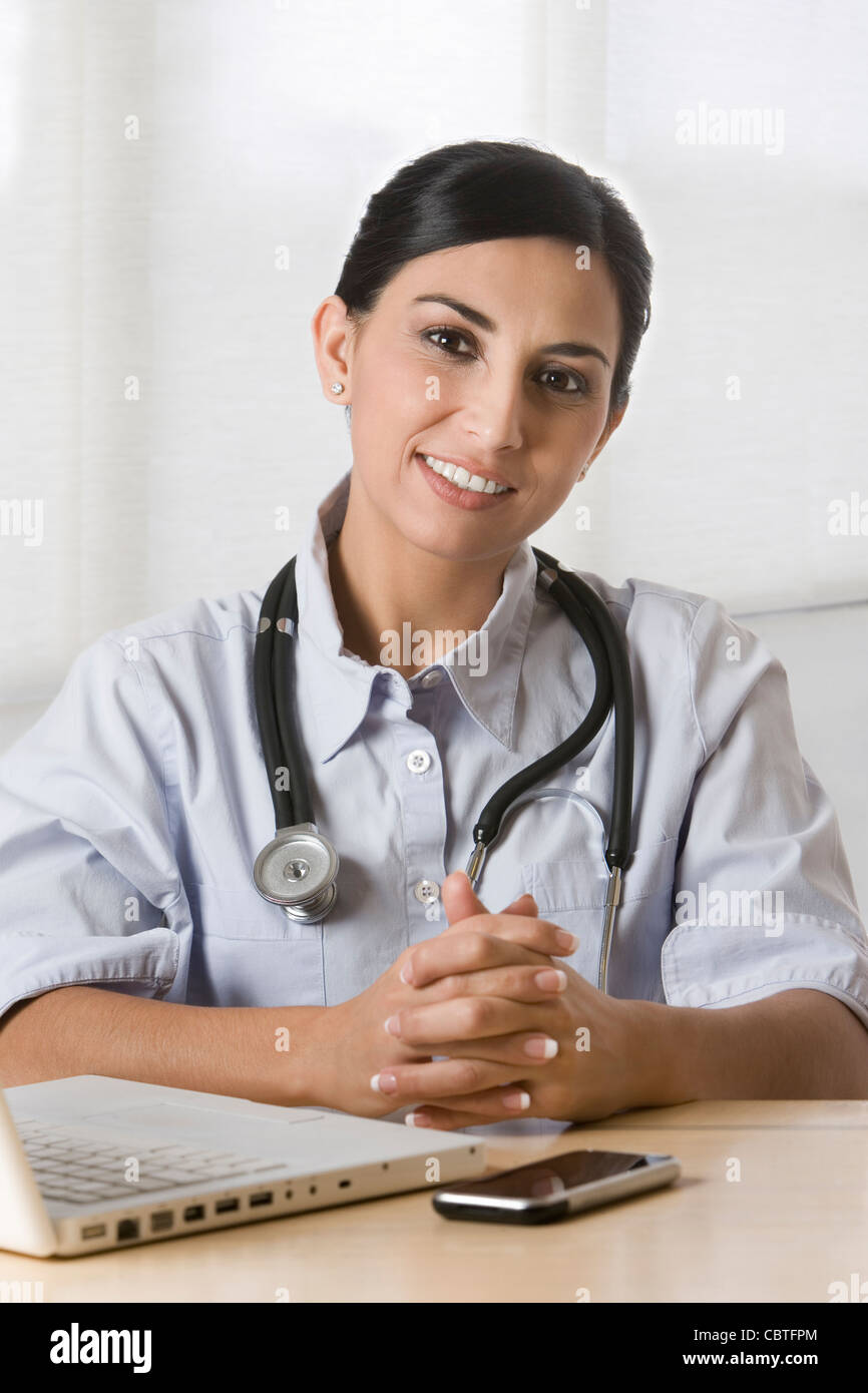 Turkish doctor sitting in doctor's office Stock Photo - Alamy