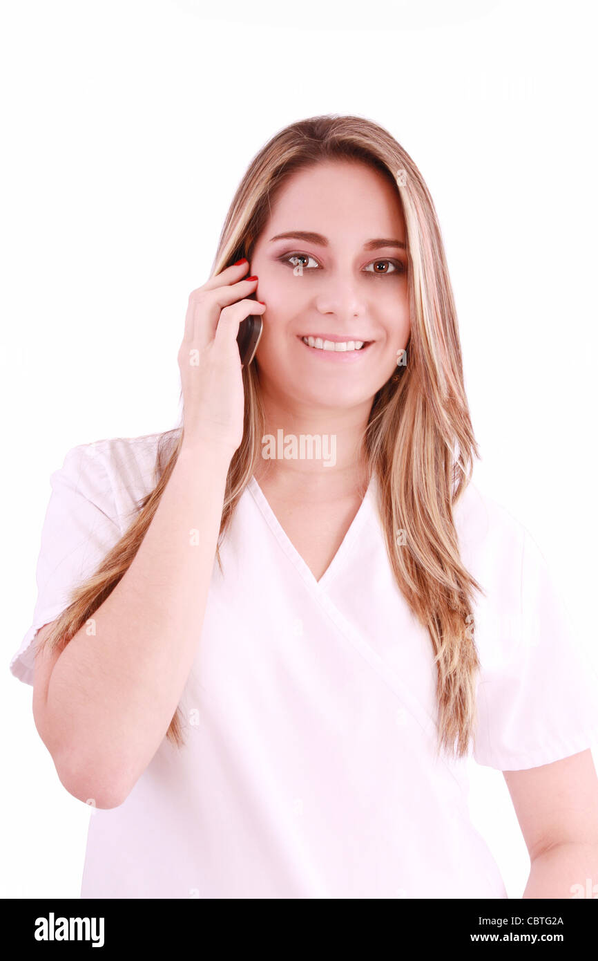 Young beautiful woman-nurse talks by mobile phone, isolated on white ... Young beautiful woman-nurse talks by mobile phone, isolated on white ...